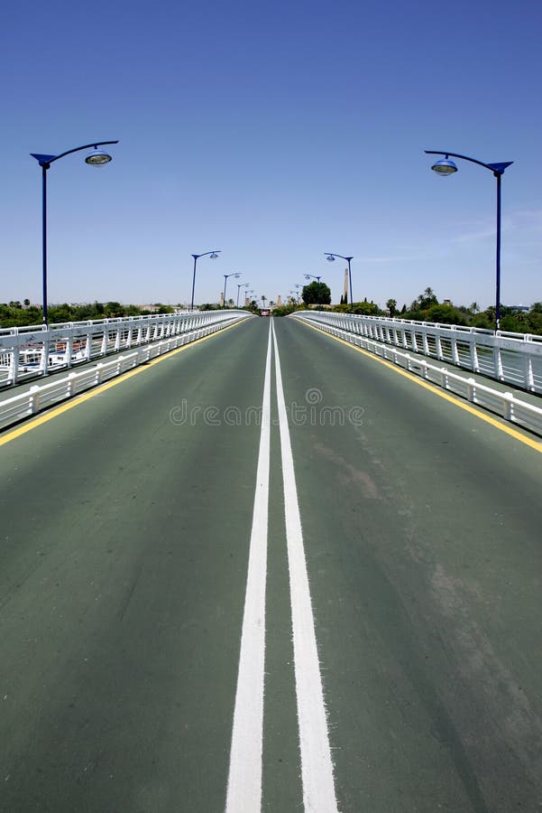 Converging Lines of Road on Bridge Stock Photo - Image of blue, travel ...