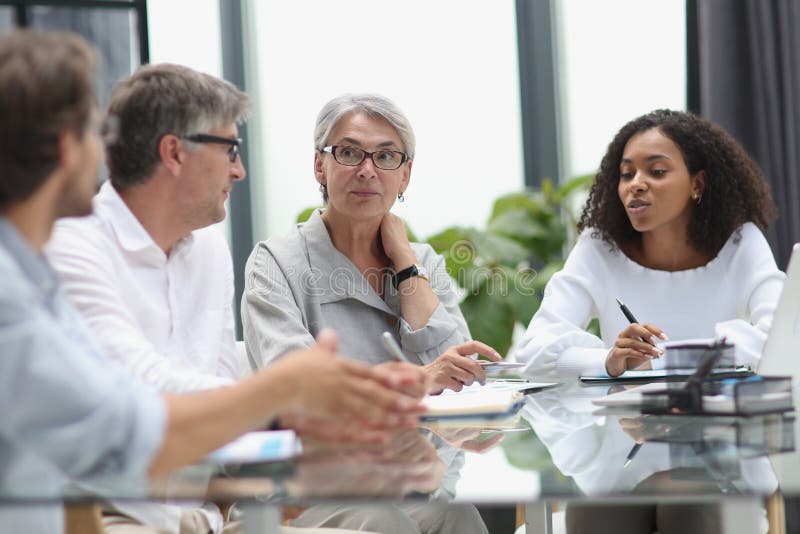 Conversation between Managers and Employees in the Office at the Table ...