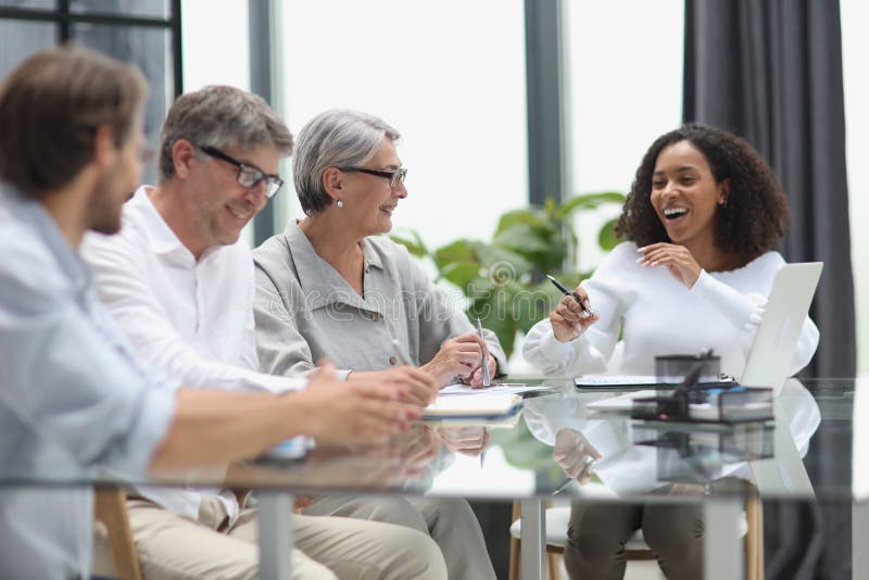 Conversation between Managers and Employees in the Office at the Table ...