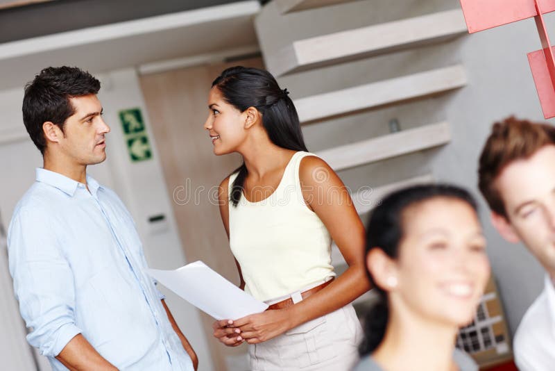 Conversation in the Office. Two Colleagues Discussing a Project Brief ...