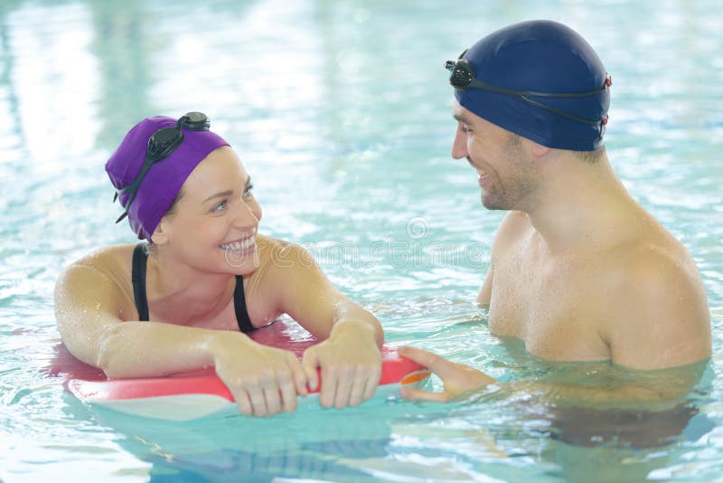 Conversation in Swimming Pool Stock Photo - Image of couple, friend ...