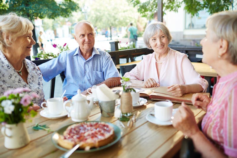Conversation by table stock photo. Image of gathering - 76564476