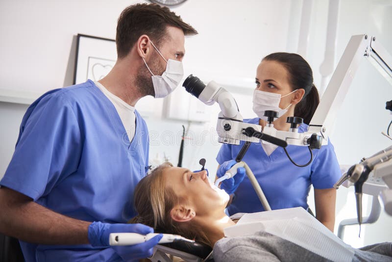 Conversation Between Two Dentist In Dentist`s Clinic Stock Image