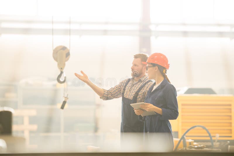 Conversation in workshop stock photo. Image of explaining - 144211760