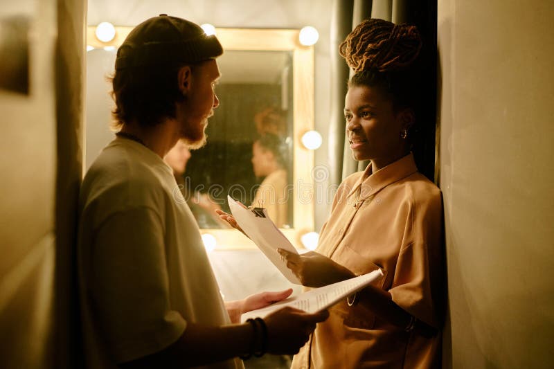 Conversing Backstage Under Warm Lighting in Theater Room Stock Image ...