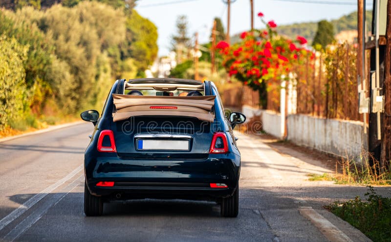 A Convertible Car is Driving Along the Road. Stock Photo - Image of ...