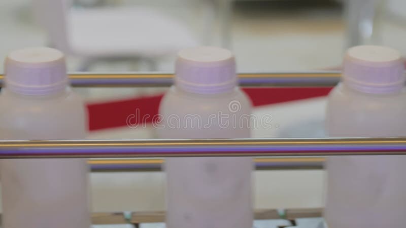 Conveyor Belt of Bottle Labeling Machine with Empty White Plastic ...