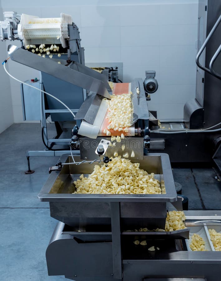 Conveyor Line for Frying Snacks and Chips in a Modern Factory Stock ...