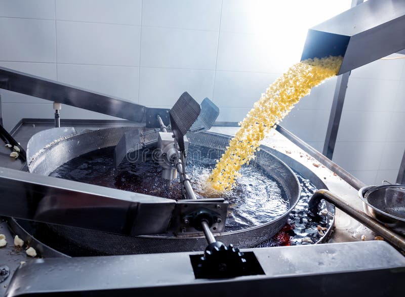 Conveyor Line for Frying Snacks and Chips in a Modern Factory Stock ...