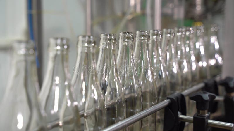Conveyor Line with Moving Empty Clean Transparent Bottles. Beverage ...
