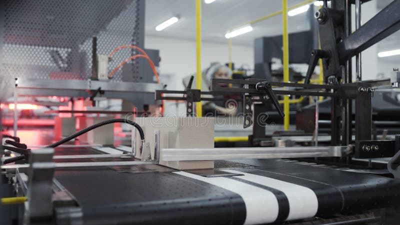 Conveyor Line for the Production of Boxes. Machine Carves and Bends ...