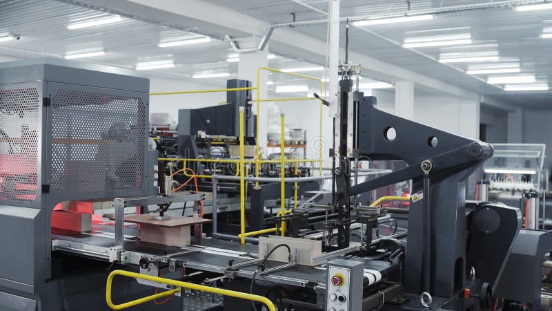 Conveyor Line for the Production of Boxes. Machine Carves and Bends ...
