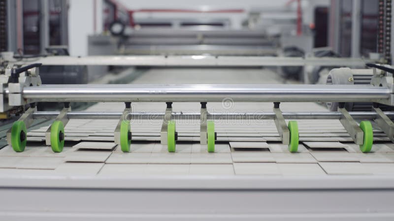 Conveyor Line for the Production of Boxes. Machine Carves and Bends ...