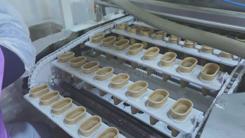 Baking Waffle Cups for Ice Cream. Conveyor Line for the Production of ...