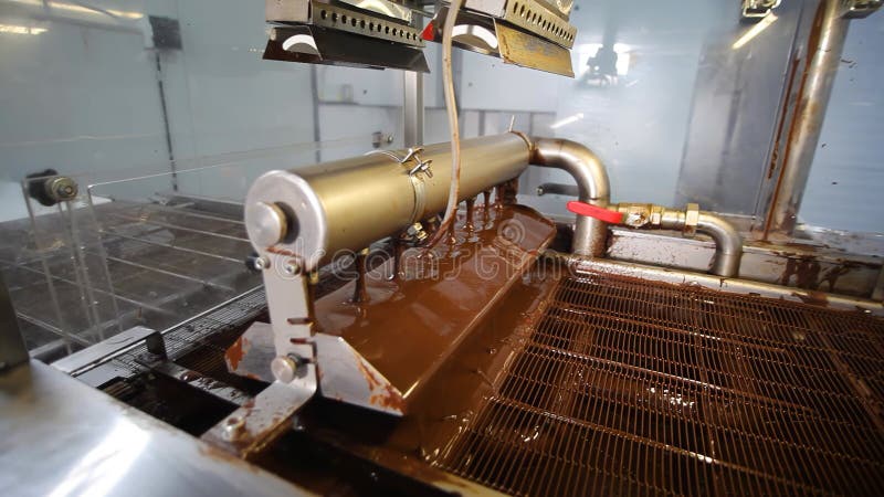 Conveyor with Liquid Chocolate. Confectionery Factory. Chocolate ...