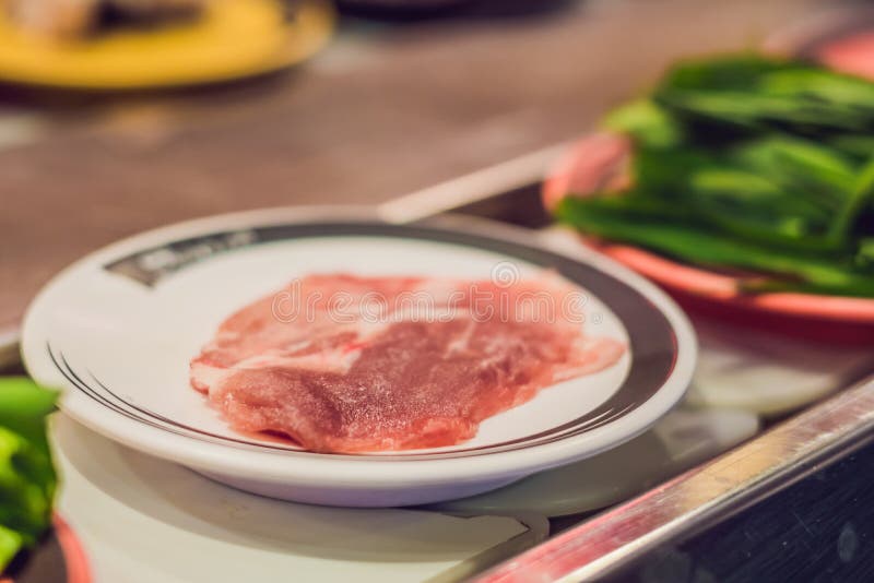 A Conveyor with Raw Food on Plates in a Cafe Stock Photo - Image of ...