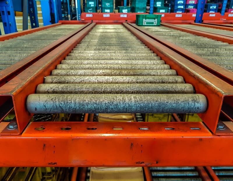 Conveyor Rollers in Distribution Warehouse Stock Photo - Image of ...