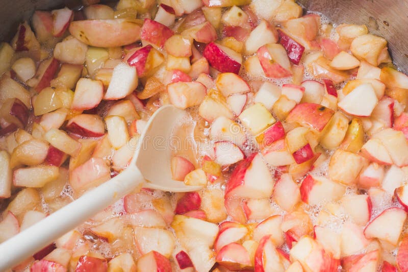 Cook Apple Jam and Stir with a White Plastic Spoon. Process of M Stock ...