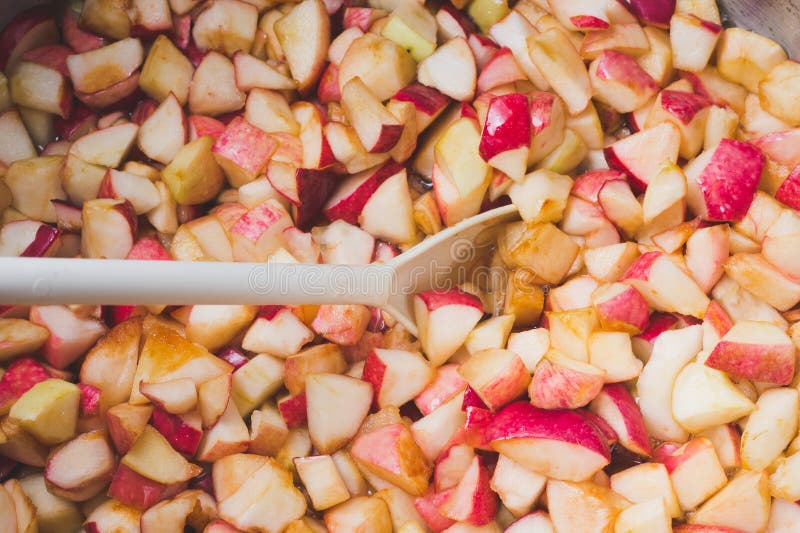 Cook Apple Jam and Stir with a White Plastic Spoon. Process of M Stock ...