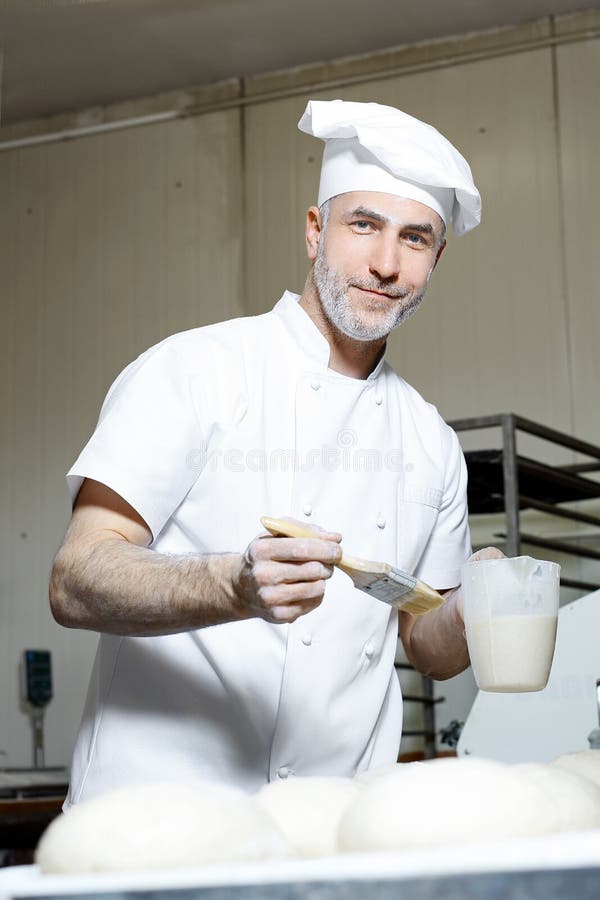 The cook is baking bread. stock image. Image of tradition - 115202189