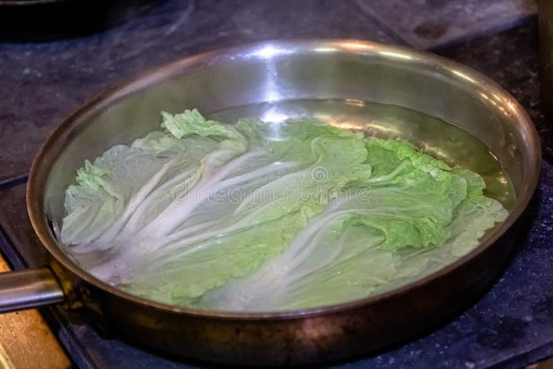 The Cook is Boiling Cabbage Leaves for Cabbage Rolls Stock Image ...