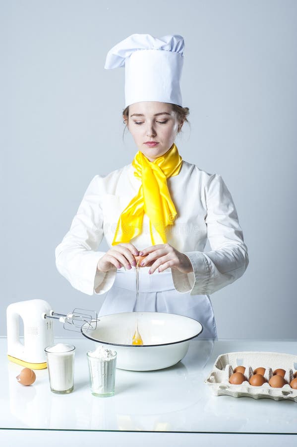 Cook breaking egg stock photo. Image of female, indoors - 49963952