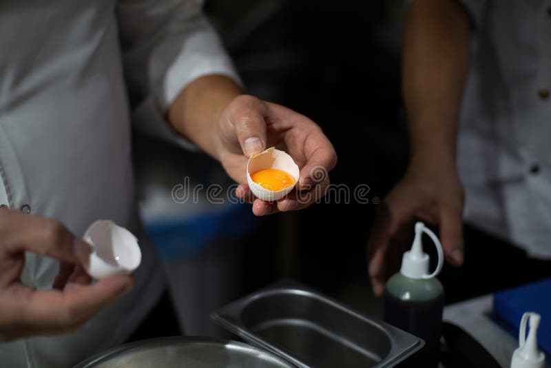 Cook Breaking Eggs. Egg Yolk Stock Photo - Image of fall, motion: 267614704