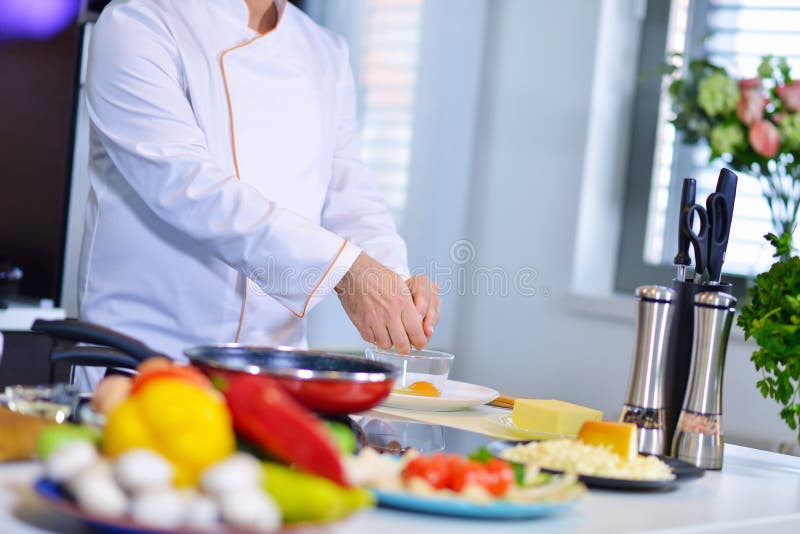 Cook Chef in Kitchen and Fresh Vegetables on Table Stock Photo - Image ...