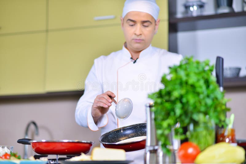 Cook Chef in Kitchen and Fresh Vegetables on Table Stock Image - Image ...