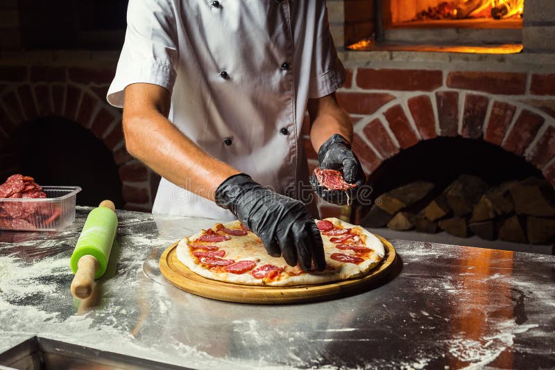 Cook Chef Making Delicious Pizza at the Restaurant, Close-up Stock ...
