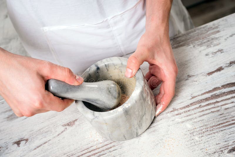 Cook chef with a mortar stock photo. Image of cuisine - 85789652