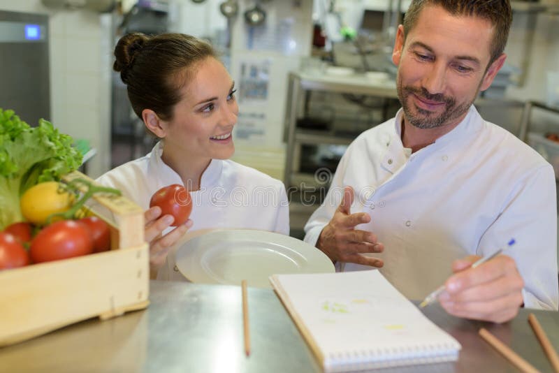 Cook chefs at work stock photo. Image of preparing, chef - 335187612