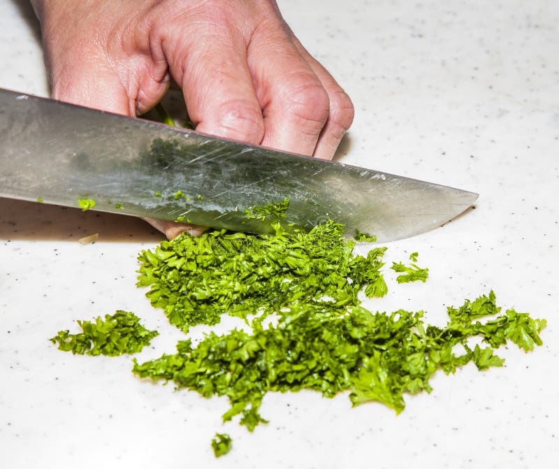 Cook is chopping herbs stock image. Image of adult, home - 35057723