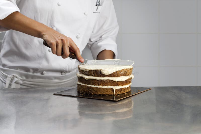Cook Coating a Cake with Cream Stock Image - Image of coat, pastry ...