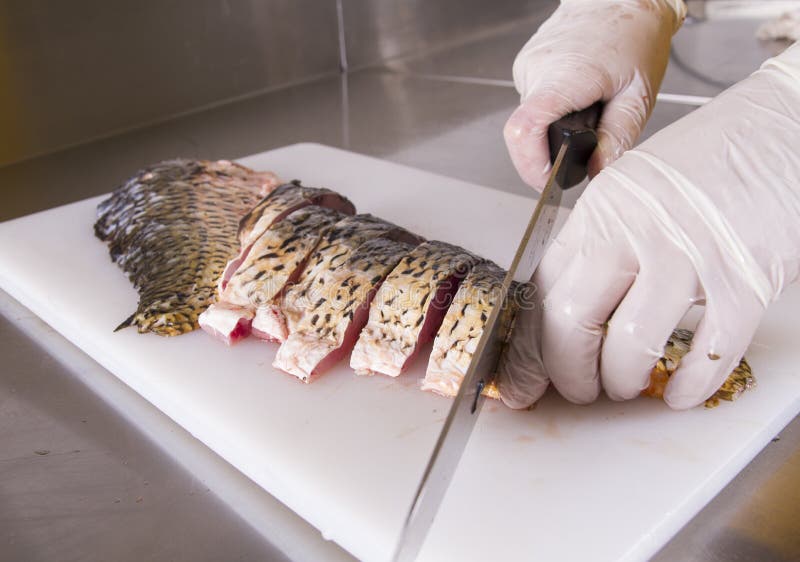 Cook Cut Up Raw Fish in Kitchen Stock Photo - Image of carp, preparing ...