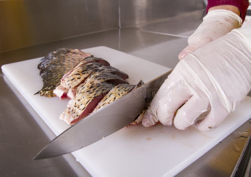 Cook Cut Up Raw Fish in Kitchen Stock Image - Image of slicing ...