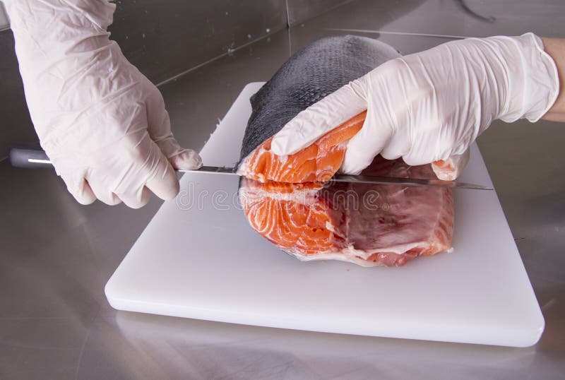 Cook Cut Up Raw Fish in Kitchen Stock Image - Image of salmon, food ...