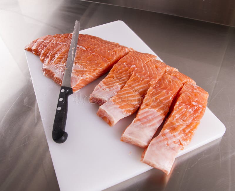 Cook Cut Up Raw Fish in Kitchen Stock Image - Image of sturgeon, hands ...