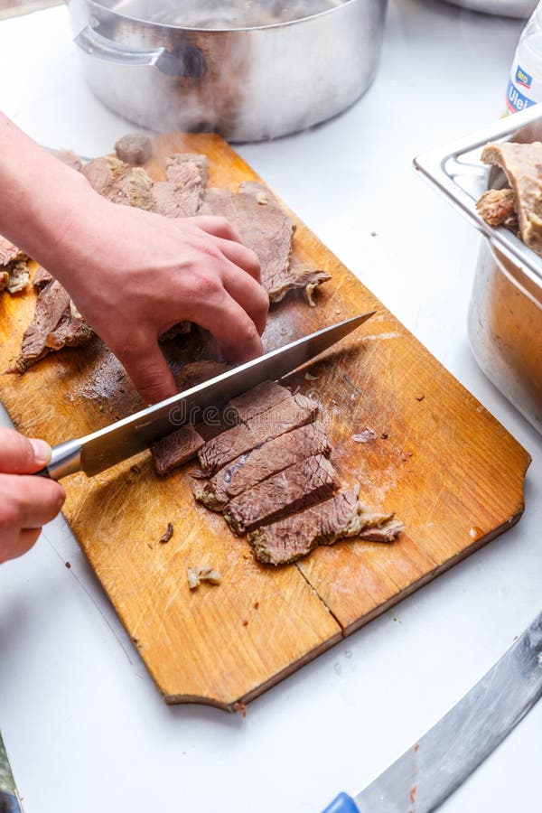 The Cook Cuts Boiled Beef Meat Stock Image - Image of cook, meat: 91847155