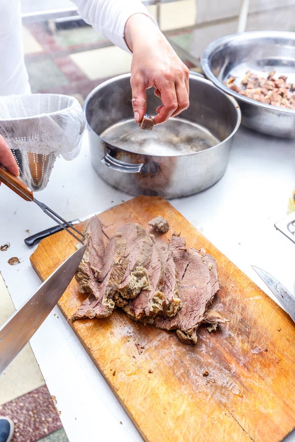 The Cook Cuts Boiled Beef Meat Stock Photo - Image of board, meat: 91985852