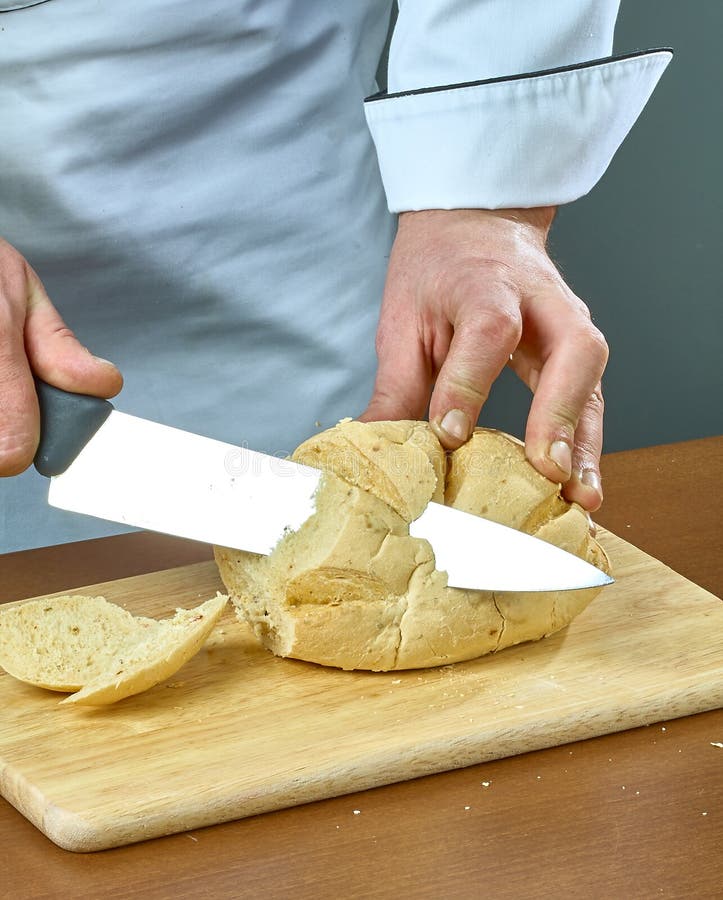 Cook Cuts Bread for Cooking Stuffed Fish Full Collection of Culinary ...