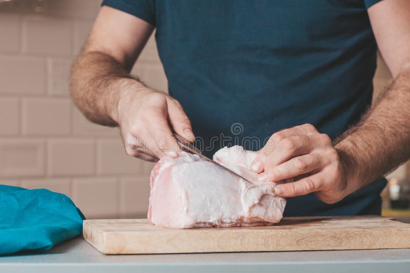 Cook Cuts Fat from a Piece of Pork Stock Photo - Image of dinner, meal ...