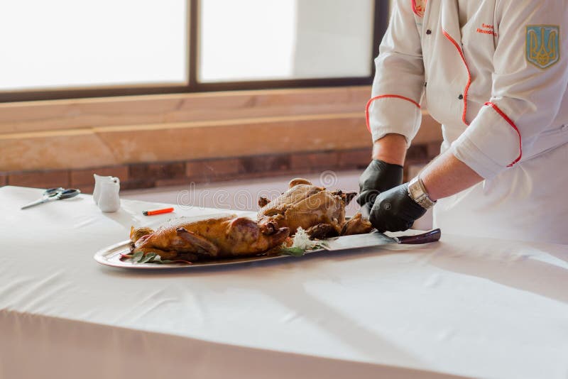 Cook Cuts Meat with a Knife on the Table Stock Image - Image of table ...