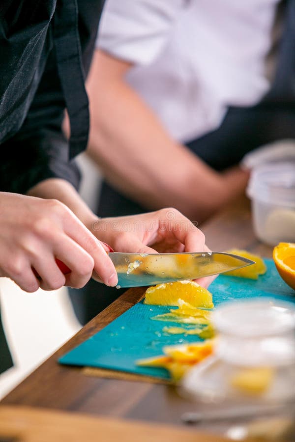 Cook Cuts an Orange. Master Class in the Kitchen. the Process of ...