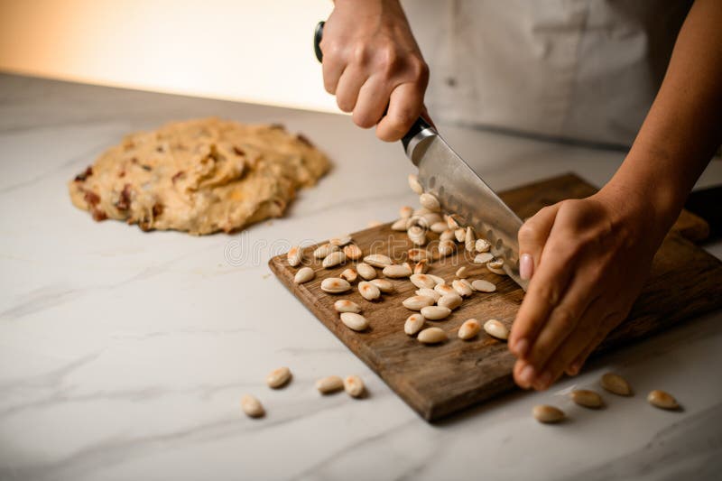 Cook Cuts Peanuts on a Cutting Board with a Knife Stock Image - Image ...