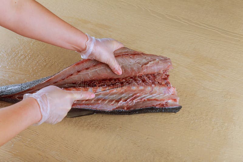 Cook Cutting Blue Fish. Separating the Bones from the Fish Stock Image ...