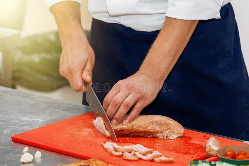 Cook Cutting a Fresh Piece of Meat Stock Photo - Image of background ...