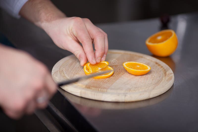 Cook Cutting Pieces of Orange Stock Image - Image of garnishing ...