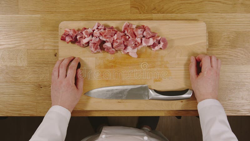 Cook Cutting Pork on a Cutting Board - Top View Stock Photo - Image of ...