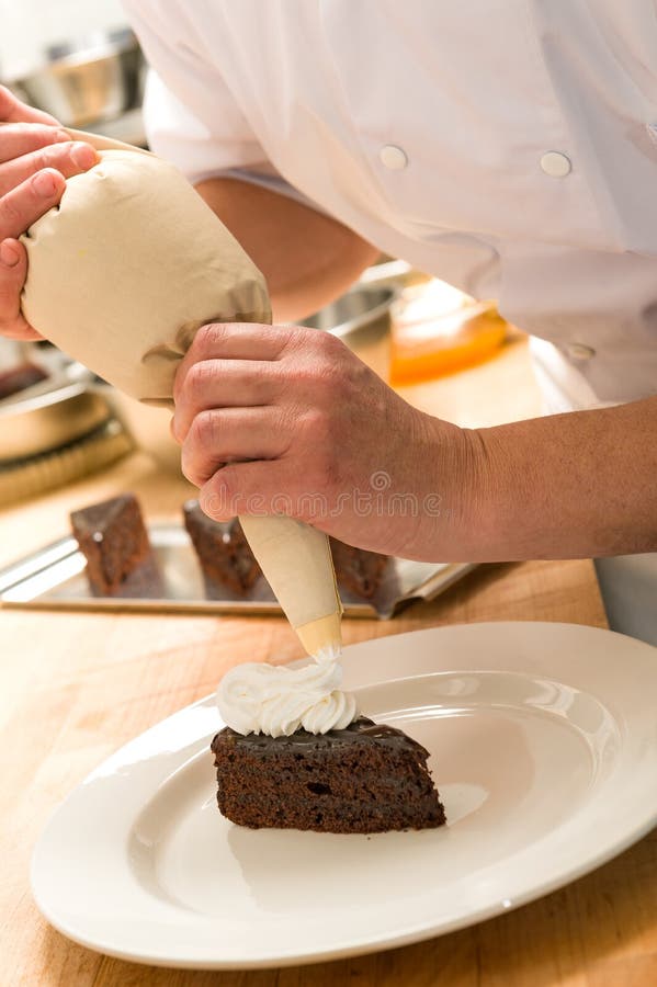 Cook Decorating Cake with Whipped Cream Stock Photo - Image of pastry ...